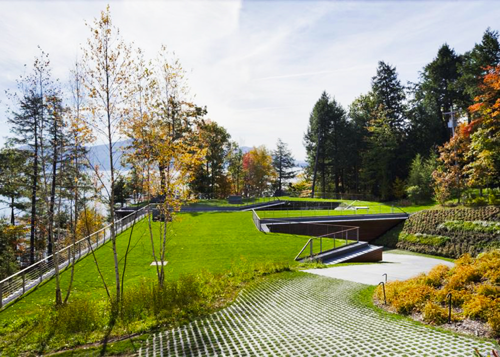 Gluck+'s Stunning Lake House is Partially Buried Under a Luscious ...
